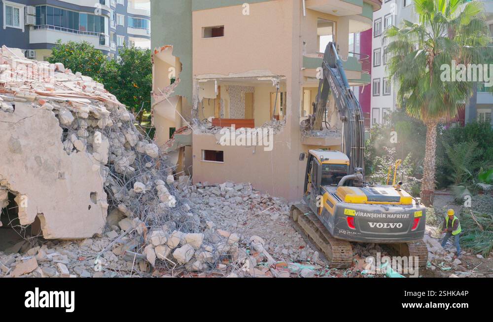 4k, Demolition machine is breaking the floors into pieces and throwing ...