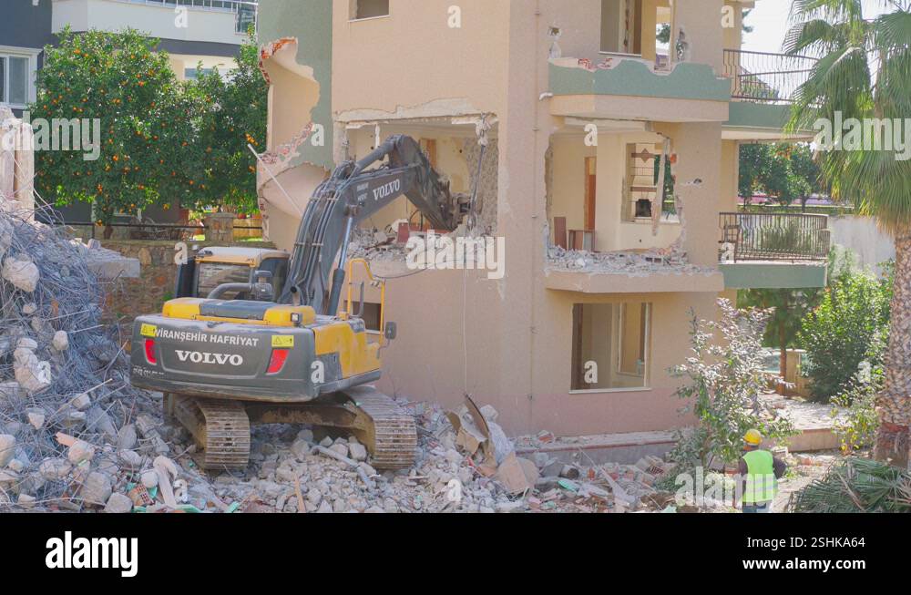 4k, Demolition machine is breaking the floors into pieces and throwing ...