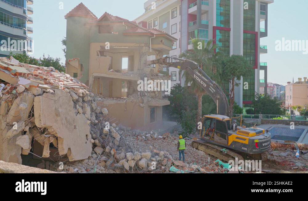 4k, Demolition machine is breaking the floors into pieces and throwing ...