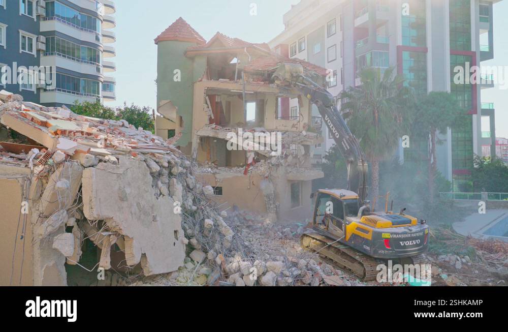 4k, Demolition machine is breaking the floors into pieces and throwing ...