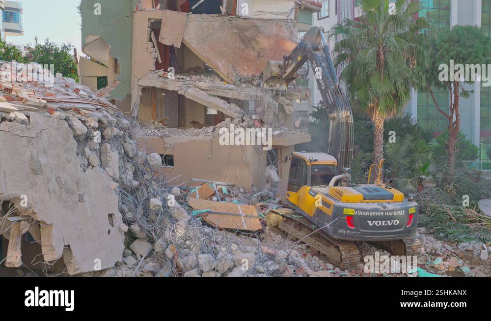 4k, Demolition machine is breaking the floors into pieces and throwing ...