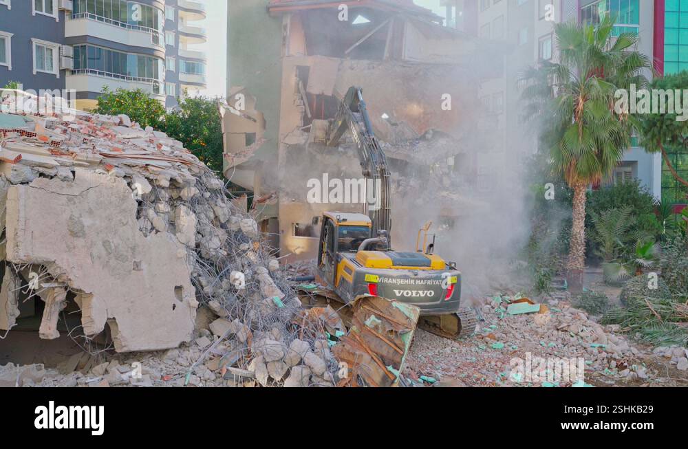 4k, Demolition machine is breaking the floors into pieces and throwing ...