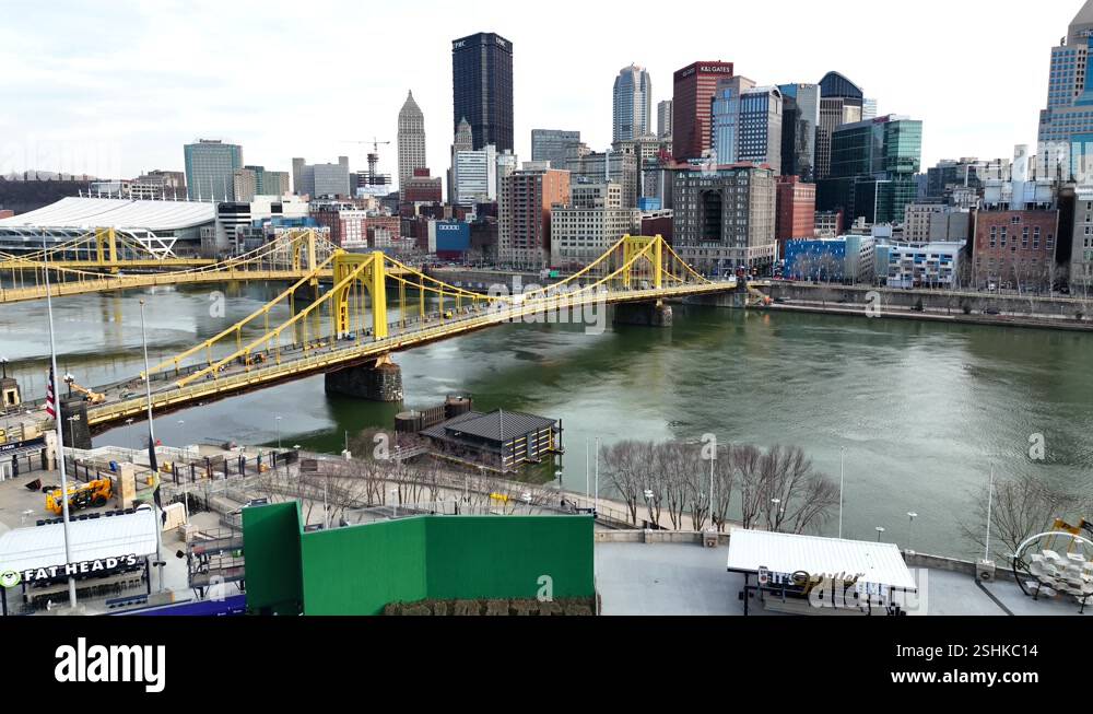 Pittsburgh skyline in the winter. Roberto Clemente bridge over a river ...