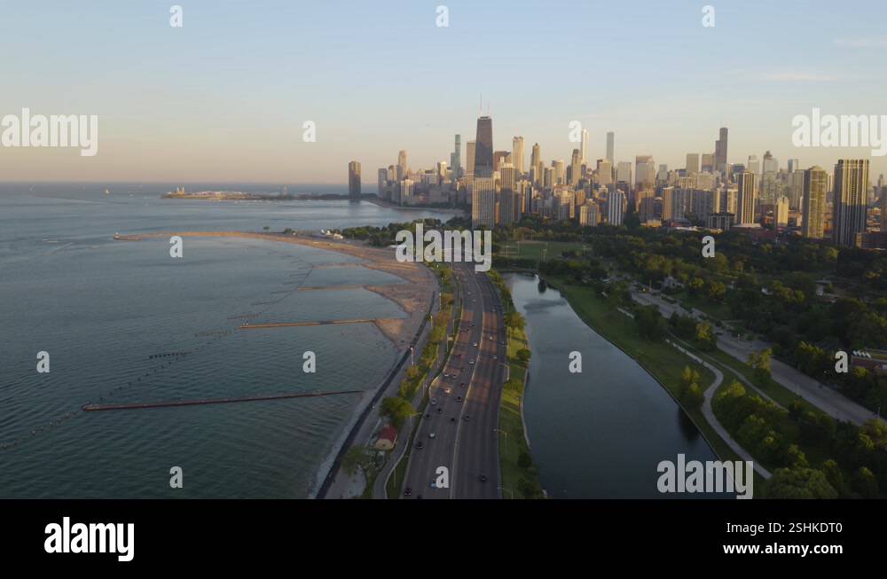 Aerial Sliding Shot Above Lake Michigan and Lincoln Park in Downtown ...