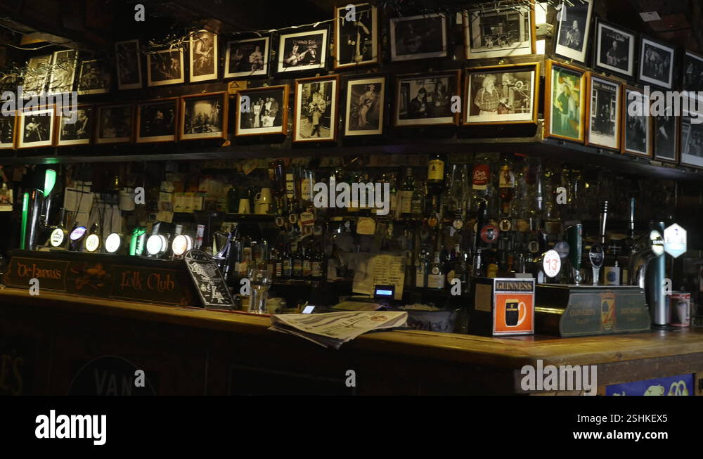 De Barra's pub inside overview; counter, lots of bottles, photographs ...