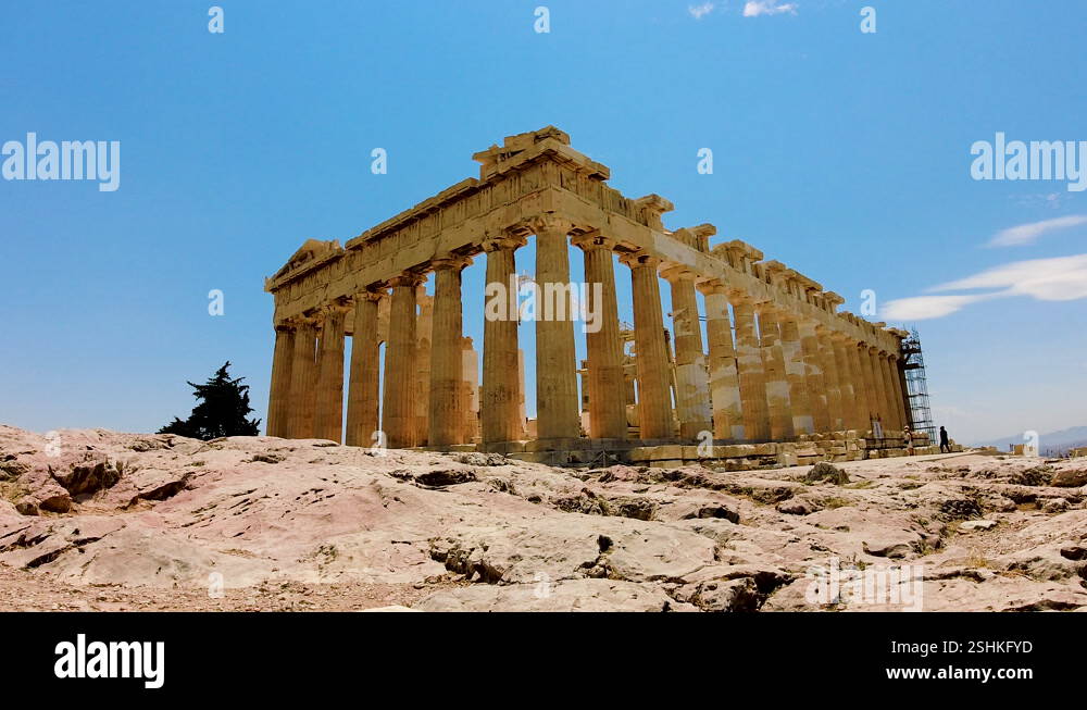 Low angle time lapse of Parthenon on Athenian Acropolis against blue ...