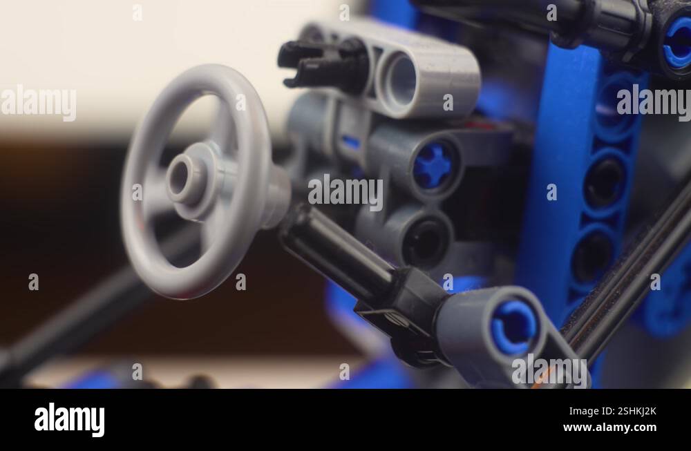 Close up rotating grey plastic mechanisms in motion, constructor for ...