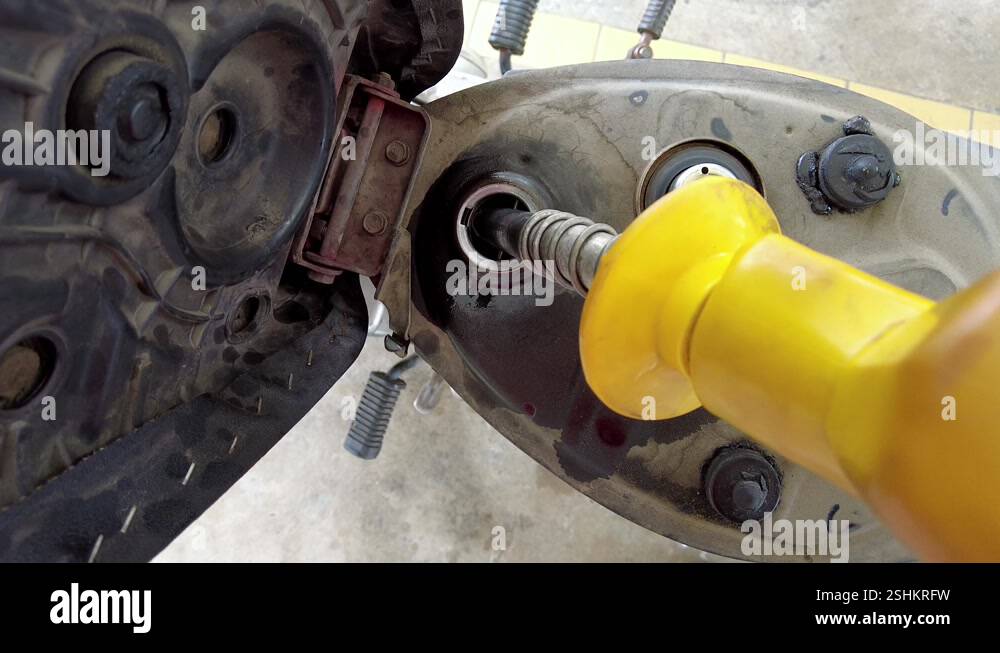 POV fill the RON 95 fuel with yellow nozzle to its motorcycle in ...