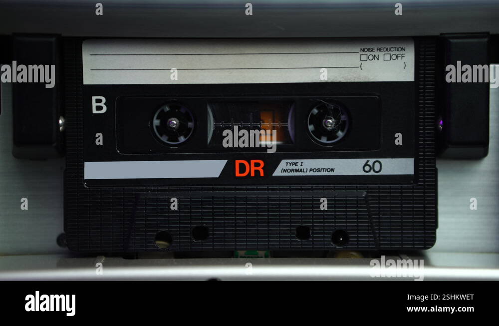 B Side of Audio Cassette Tape Rolling in Deck Player, Close Up Stock ...