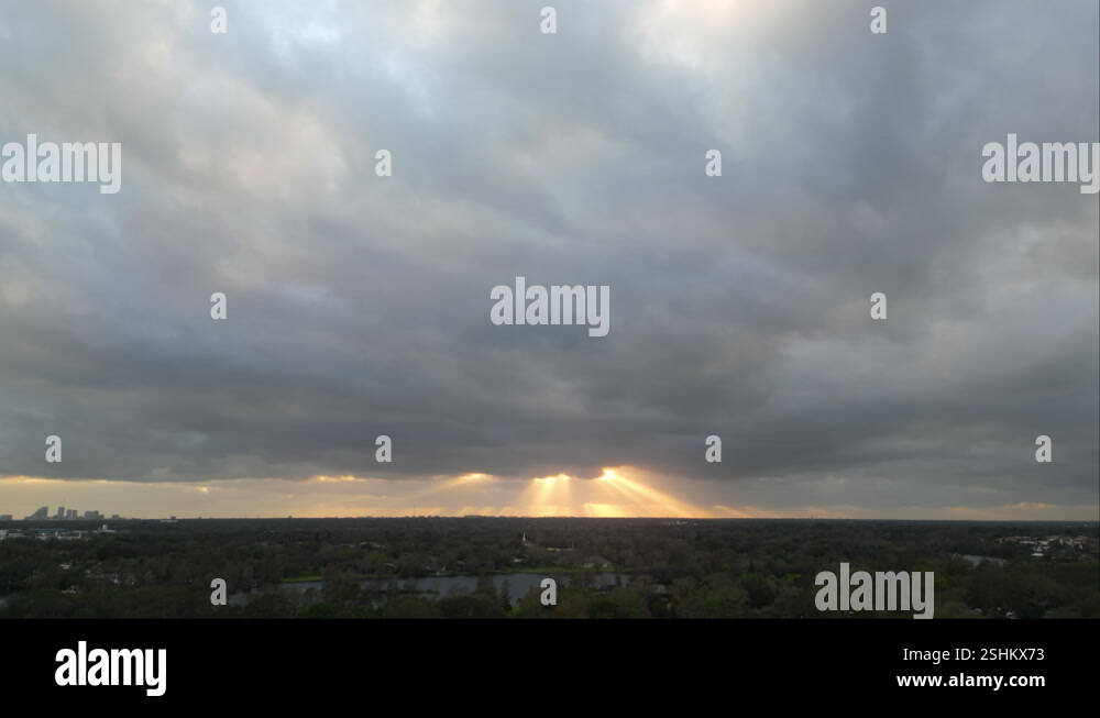 Sunlight God Rays Shining Through Grey Clouds Over Green Residential ...
