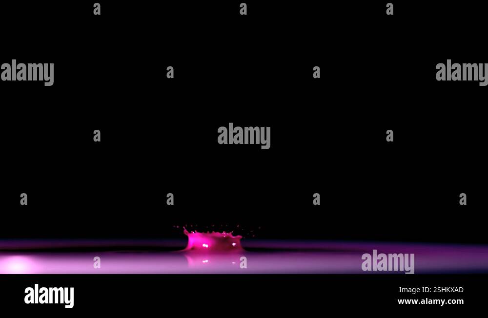 Purple drop falling on paint Stock Video Footage - Alamy