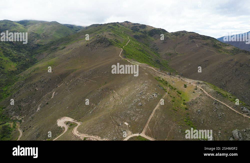 Aerial drone forward moving shot over a trekking path leading to the ...
