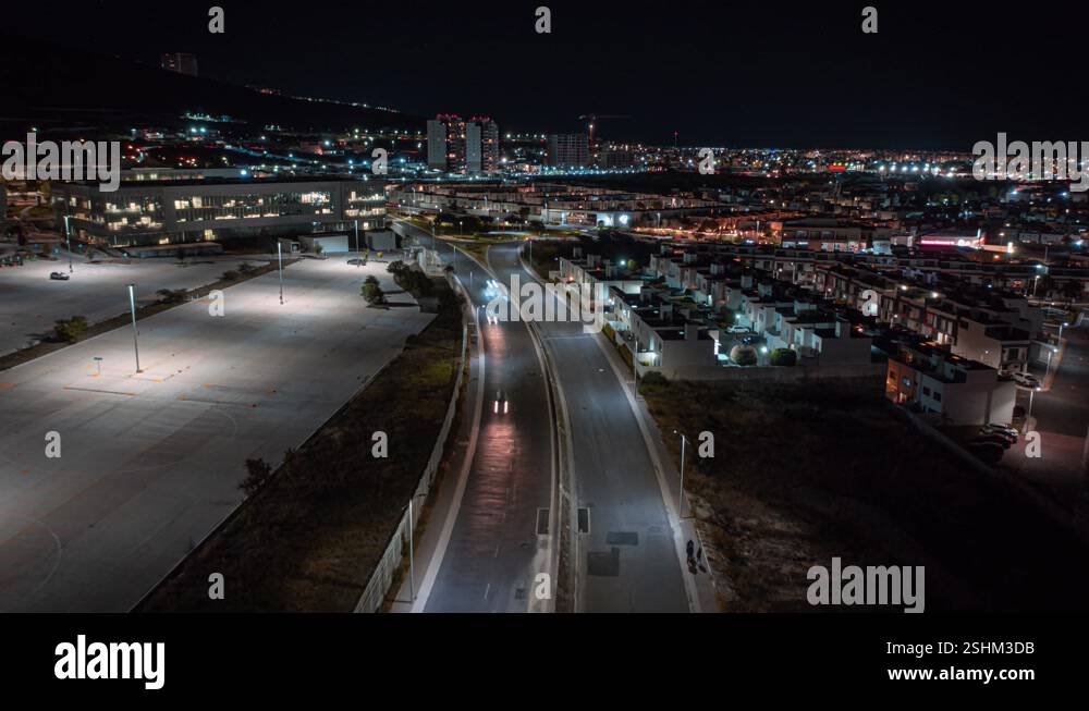 Mesmerizing drone hyper-lapse-timelapse of a bright street and ...