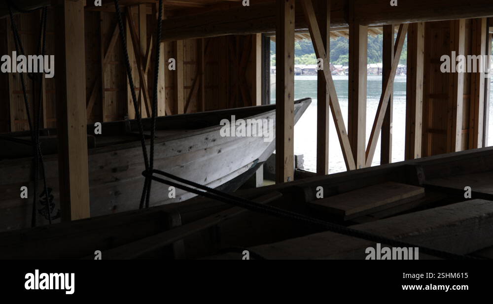 Traditional wooden boats parked inside a funaya house, Ine, Japan Stock ...