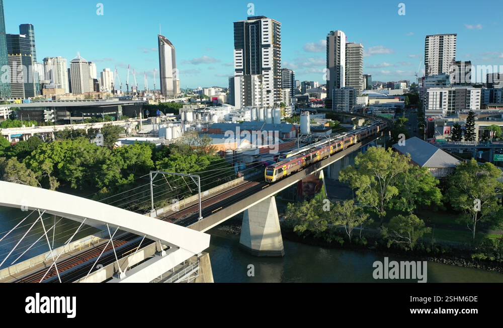 Two trains crossing river on Brisbane's iconic Merivale Railway Bridge ...