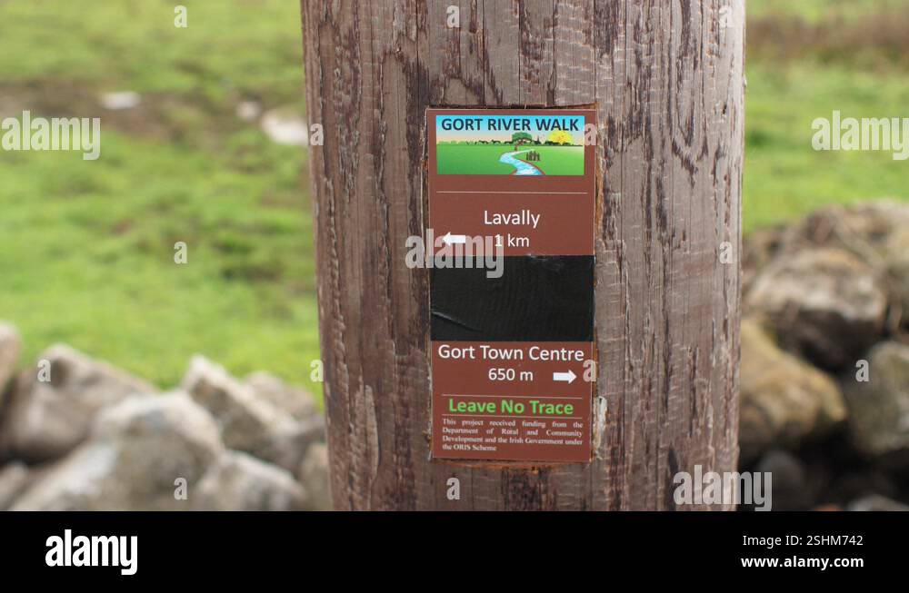 Gort river walk sign attached to a wooden post beside the river ...