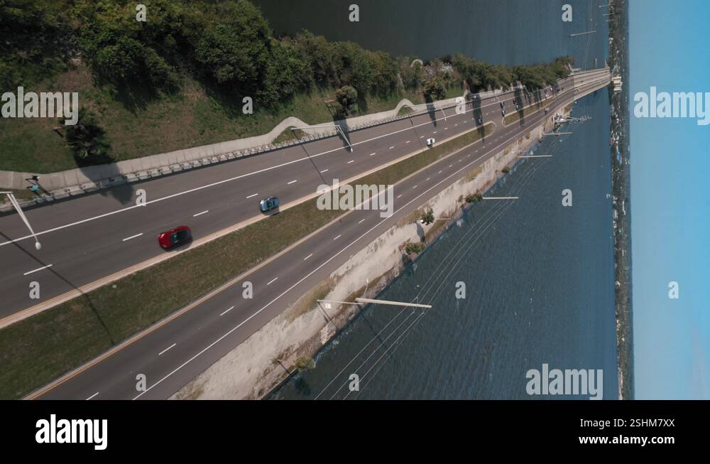 Tracking vertical drone shot flying over coastal causeway - Indian ...