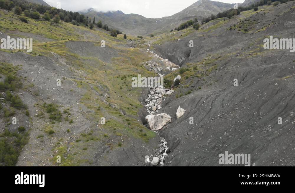 Drone video flying up Mountain gorge river canyon stream Gramos Greece ...