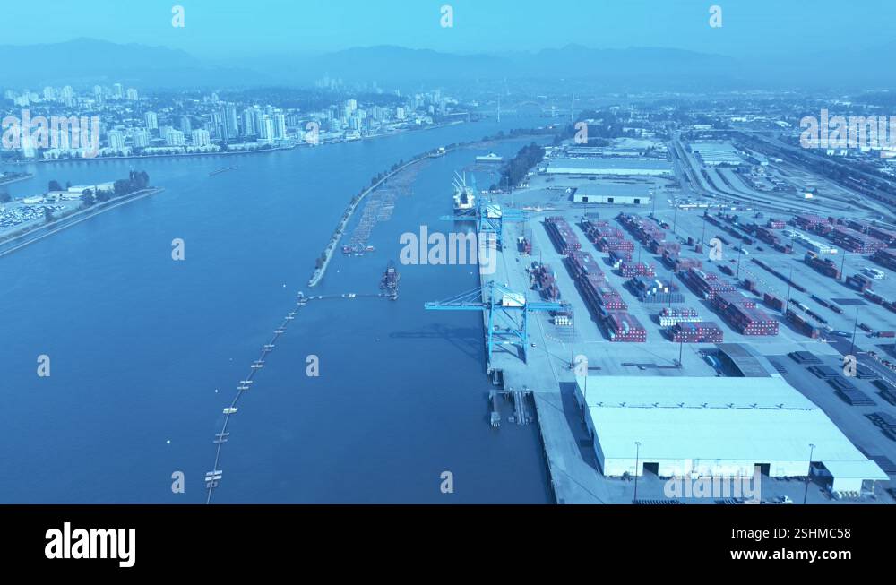 Fraser River Surrey BC Freighter loading dock motorized forklifts load ...