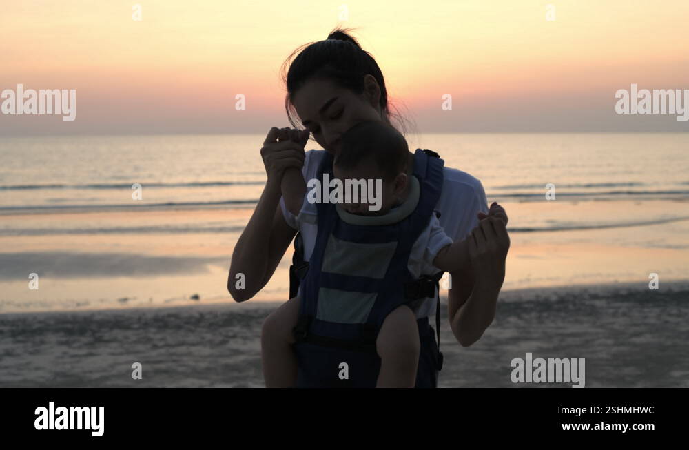 Tourism concepts of 4k Resolution. Asian mother coaxing her baby to ...