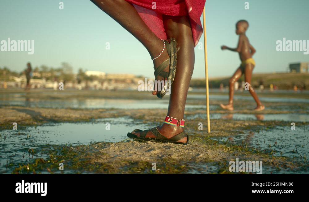 Legs Of Masai Warrior Guarding And Standing On The Beach In Watamu ...