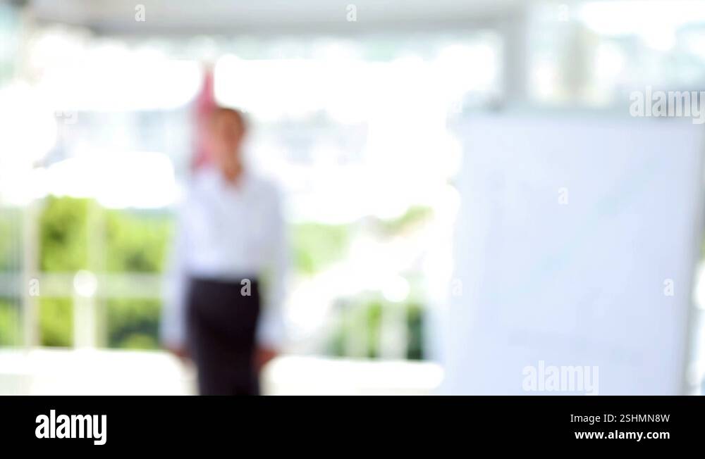 Businesswoman walking into focus Stock Video Footage - Alamy