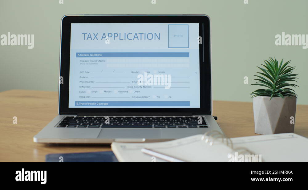 Laptop computer with an Tax application form on its display Stock Video ...