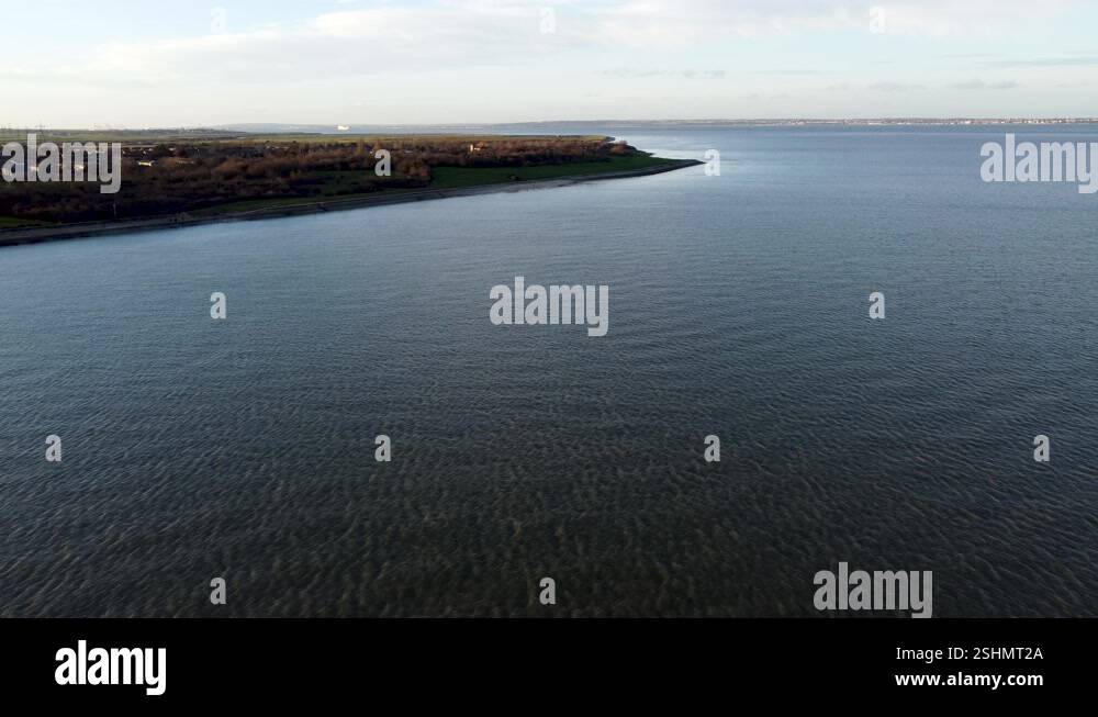 Coastal Aerial of a shore village in Isle of Grain, British Coast ...