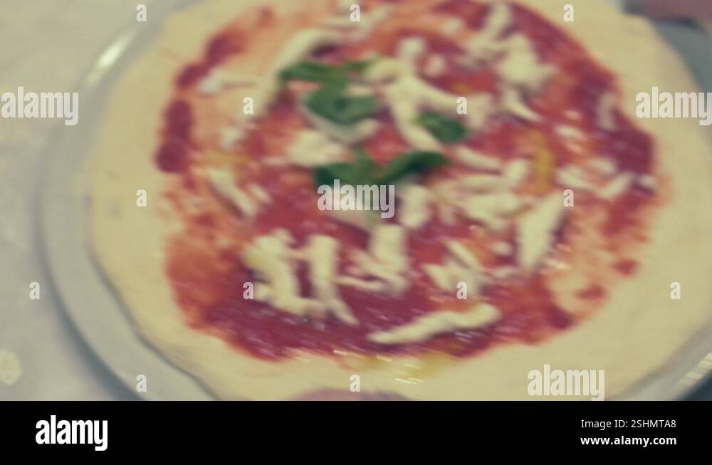 Italian Chef Shaking the Pizza plate to make sure it wont stuck before ...