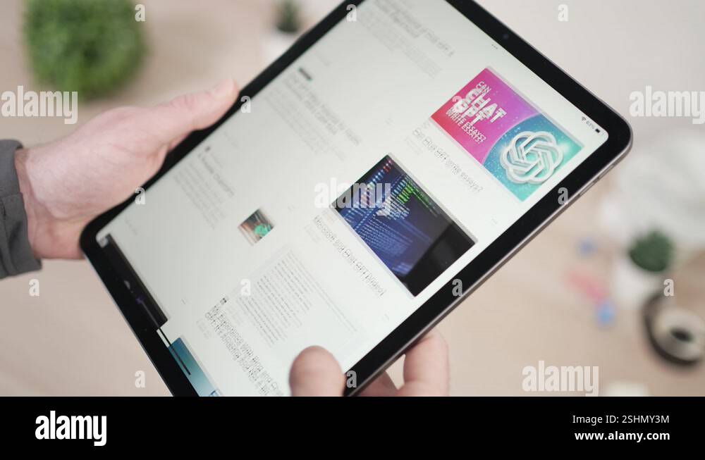 Browsing News About Chat GPT from Open Ai Online on an iPad Stock Video ...