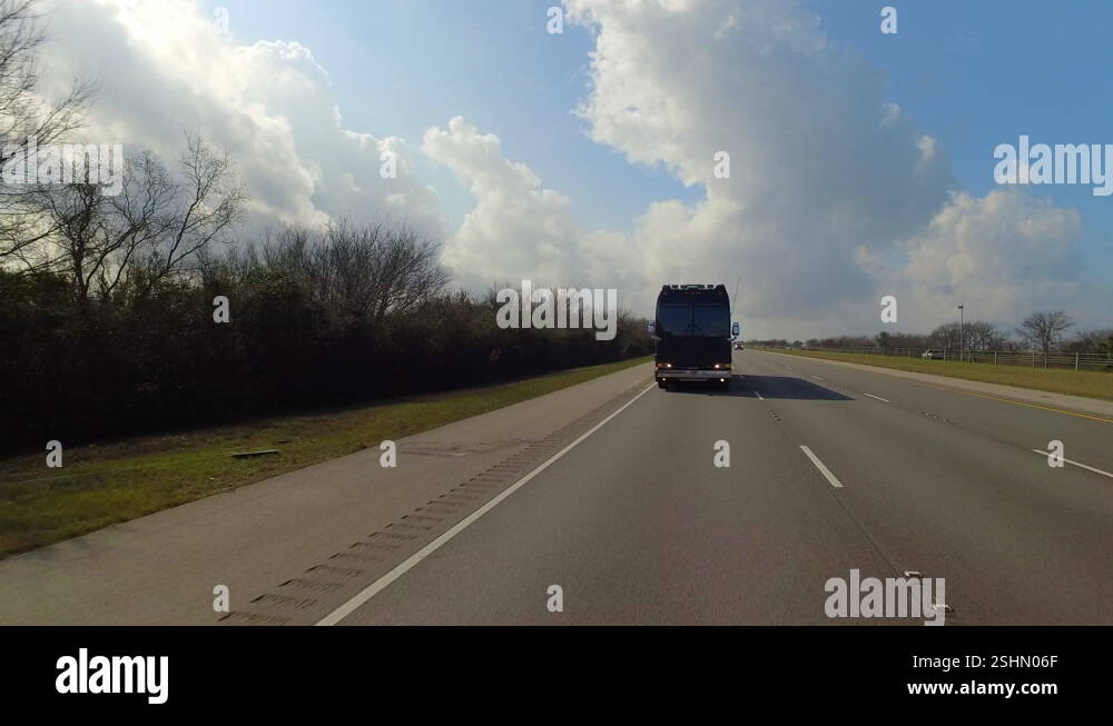 Point Of View Recreational Bus Moving On Street By Cars Under Cloudy ...