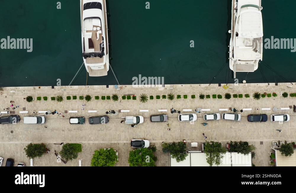 Promenade near the Budva old town wall. Aerial top shot Stock Video ...