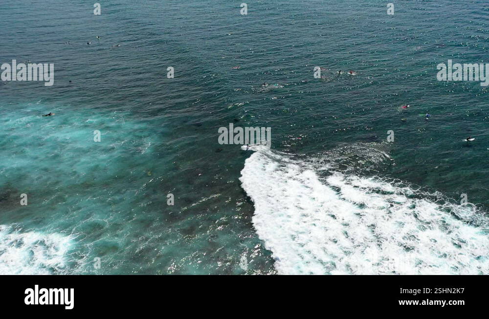 Aerial Panning Shot Of Surfer Surfboarding On Waves In Ocean, Drone ...