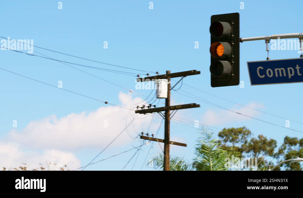 Panning To A Red Light And A Blue Compton Street Sign - Los Angeles ...