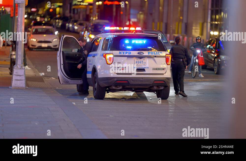 Officers alight from a NYPD Police car in Manhattan - NEW YORK CITY ...