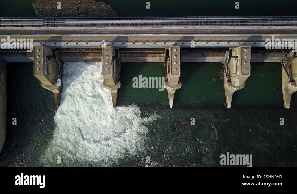 Electrical Powerplant Dam with Open Gates and Water Flowing - Aerial ...