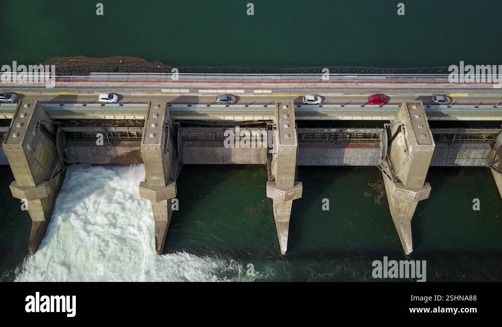 Multiple Car On Bridge Over Electrical Powerplant Dam - Aerial Drone ...