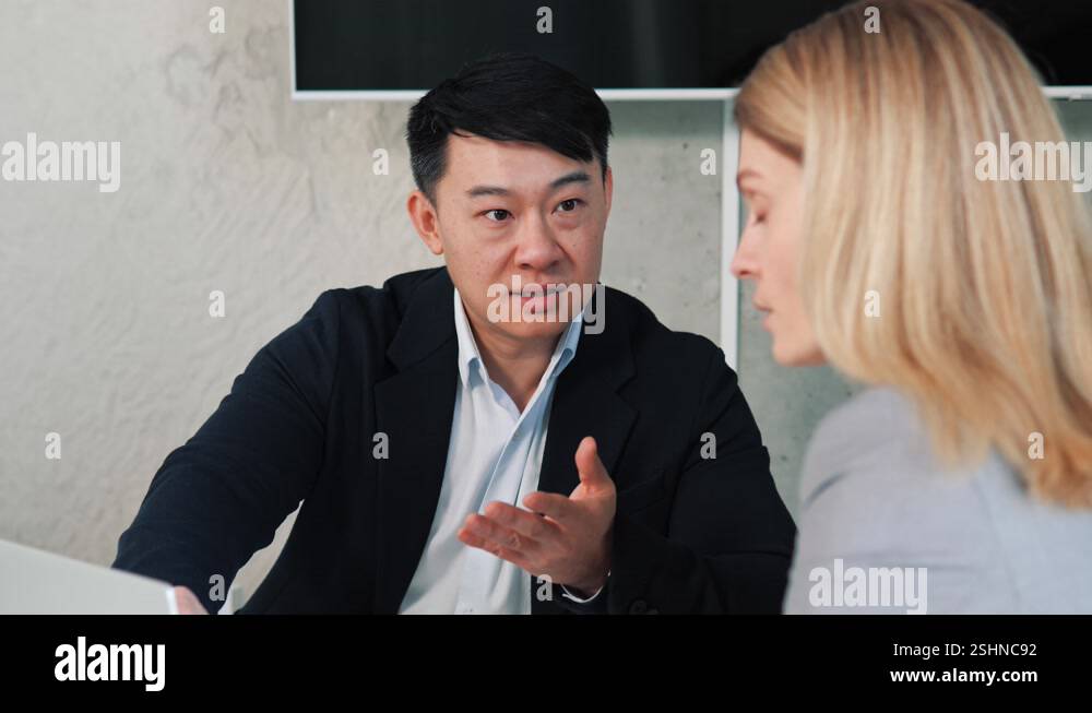 Handsome executive asian director leader investor talking with business ...