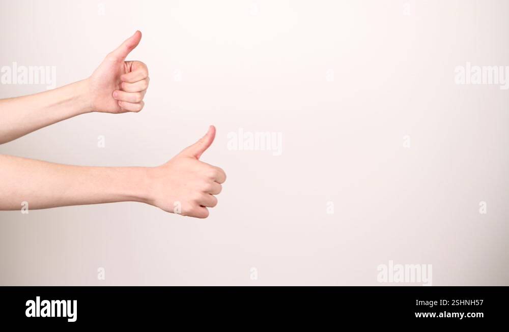 Four thumbs up coming in frame one at the time on a white background ...