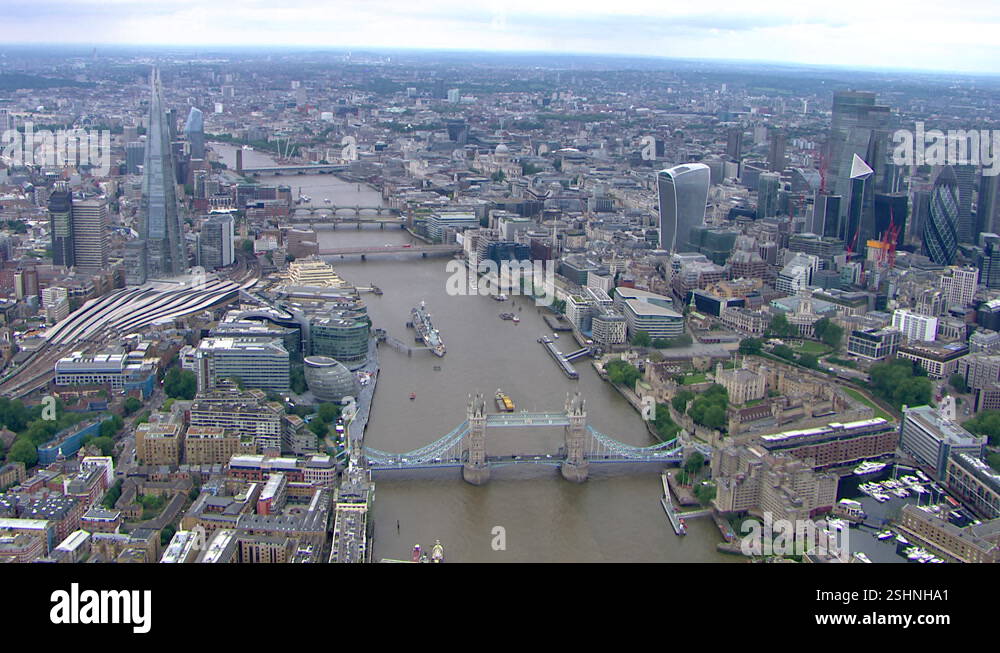 Aerial shot overhead downtown London showing the London bridge, the ...