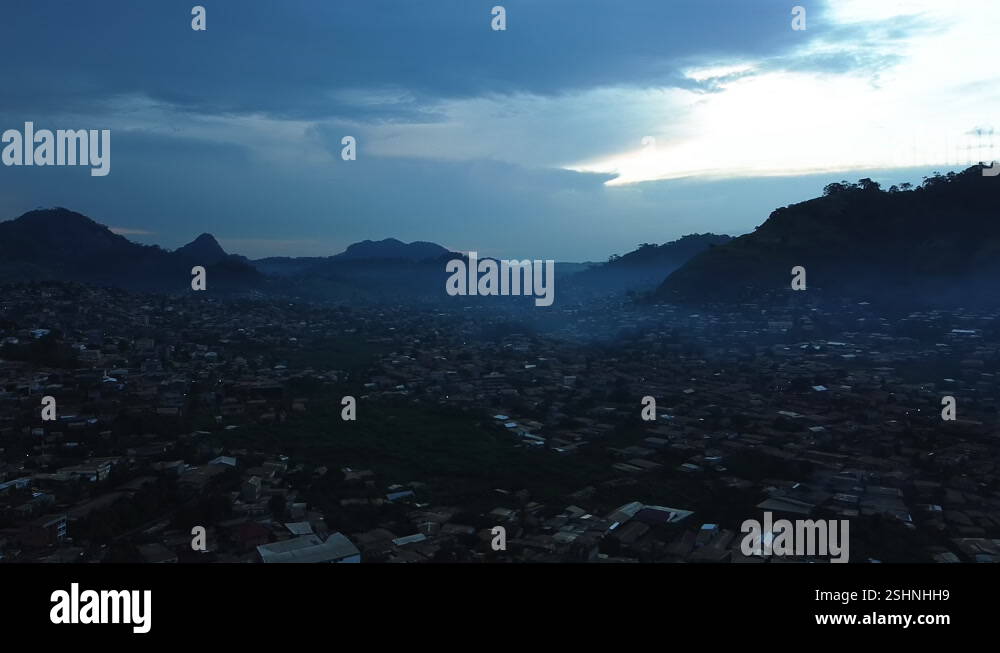 Aerial view over a suburban area in the city of Yaounde, gloomy evening ...