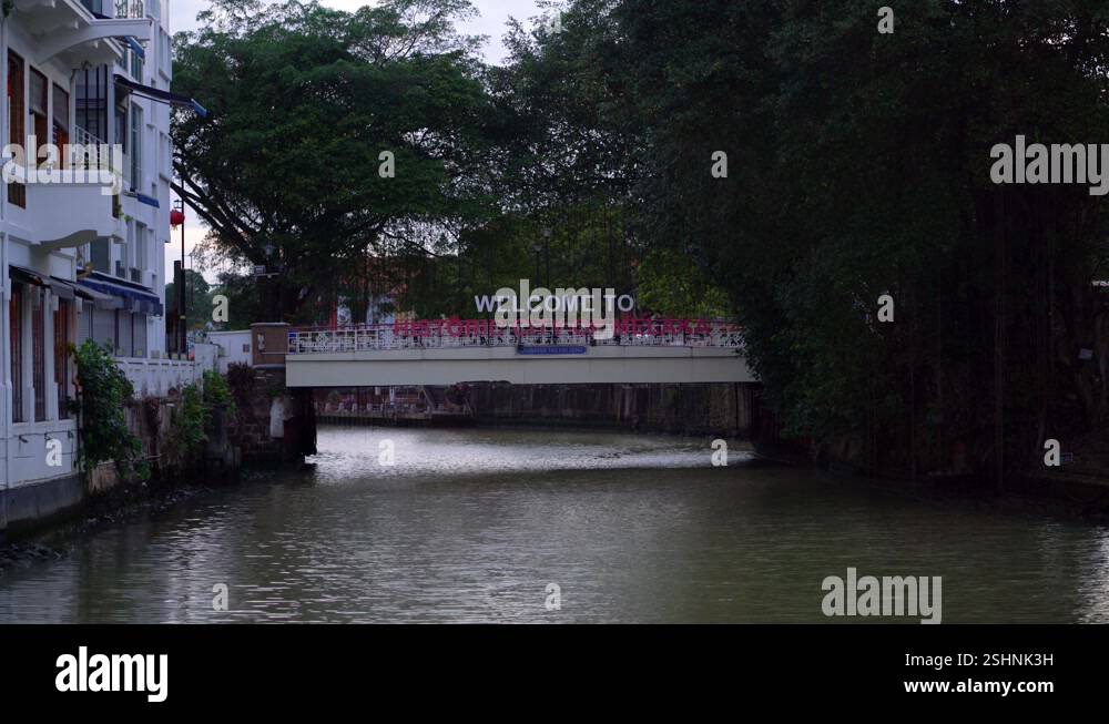 Peaceful river view of the bridge and the welcome sign to the ...