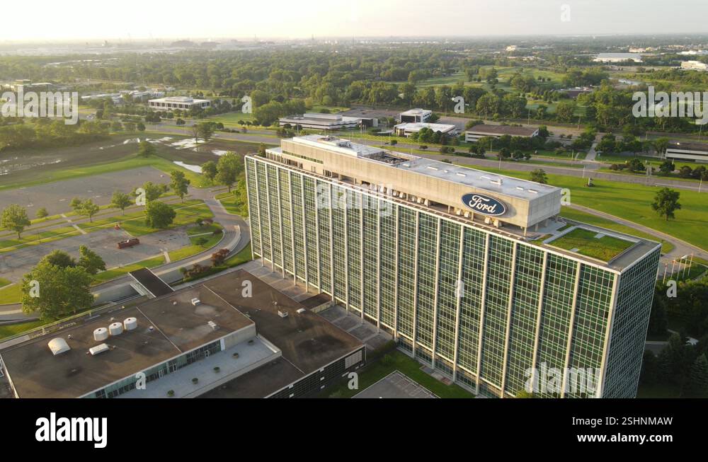 Green landscape and Ford Motors office building on sunny day, aerial ...
