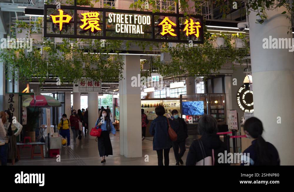 People Walking Through Past Vendors At Street Food Central Indoor ...