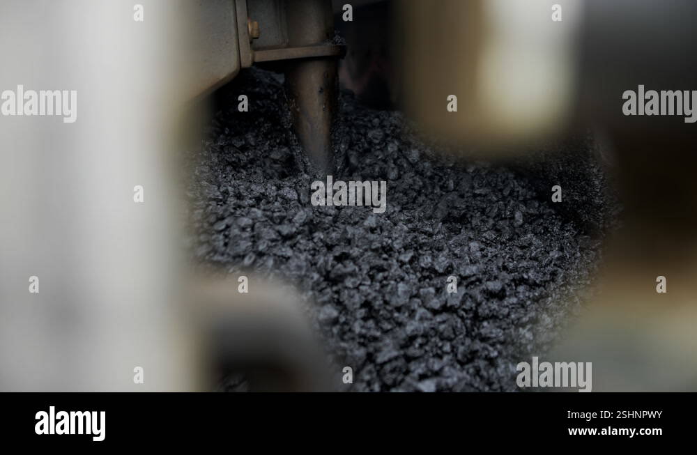 Stirring mix asphalt with gravel and tar by machine tool Stock Video ...