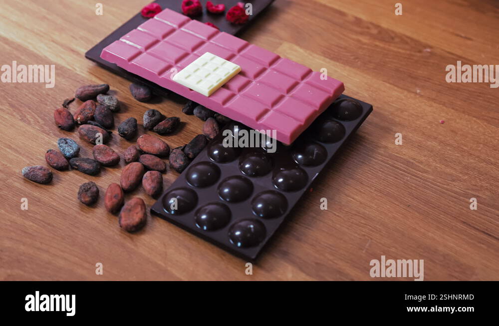 Dark chocolate bars with freeze-dried raspberries with pink chocolate ...