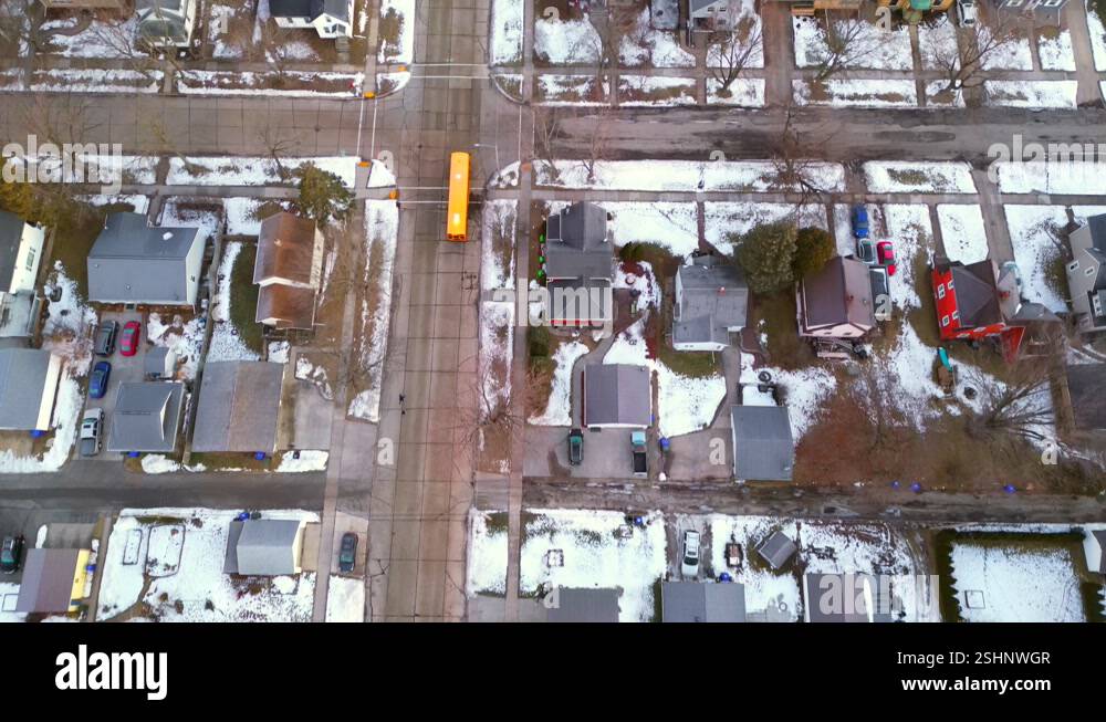 Kids panic and run, as the school bus drives past them, aerial view ...