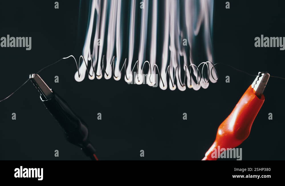 Nichrome Wire Heats Up to Red with Smoke Under High Electric Current ...