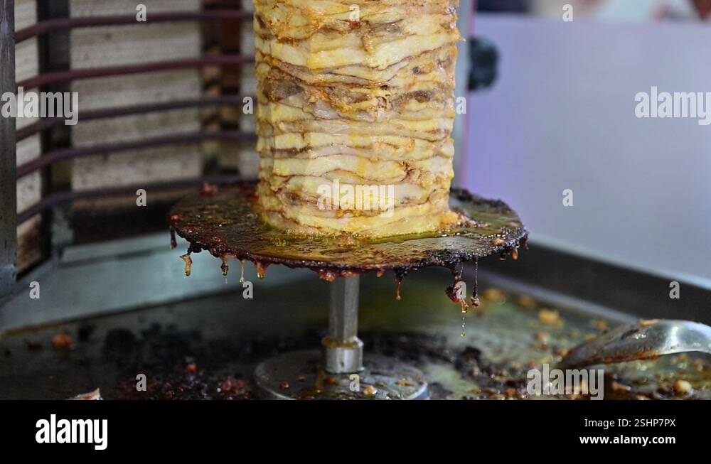 Chicken shawarma on the grill displayed during the Gulf Food Exhibition ...