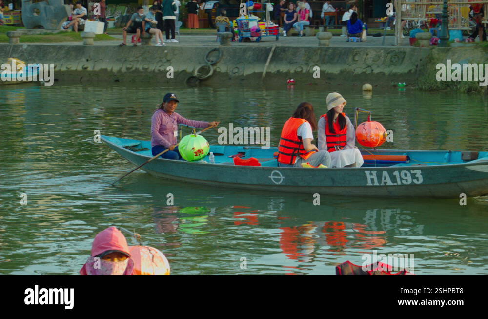 Young women tourist enjoying wooden traditional boat tour in the ...